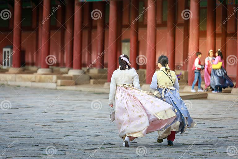 Asian Korean Woman Dressed Hanbok In Traditional Dress Walking In