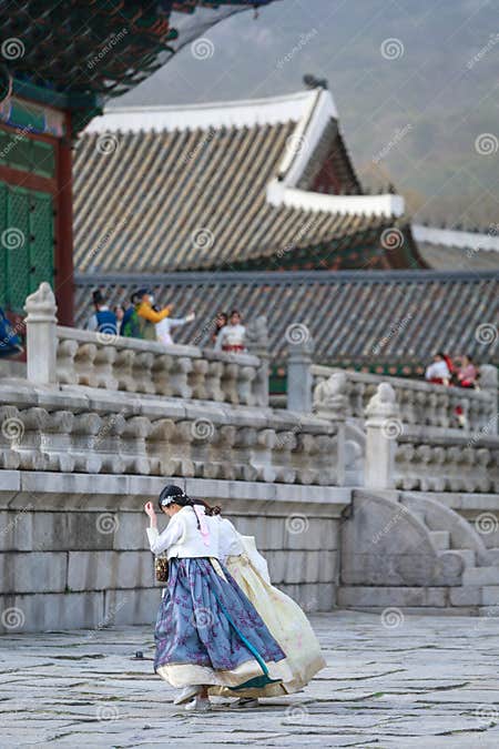 Asian Korean Woman Dressed Hanbok In Traditional Dress Walking In