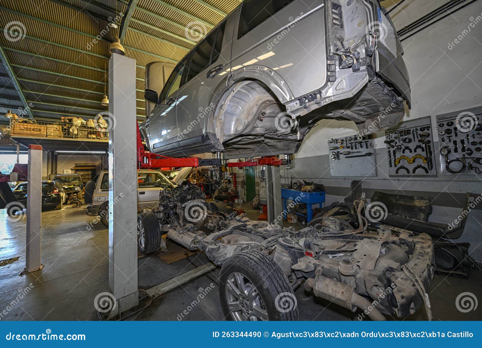 Repair of a Vehicle in the Elevator of a Mechanical Workshop. Stock ...