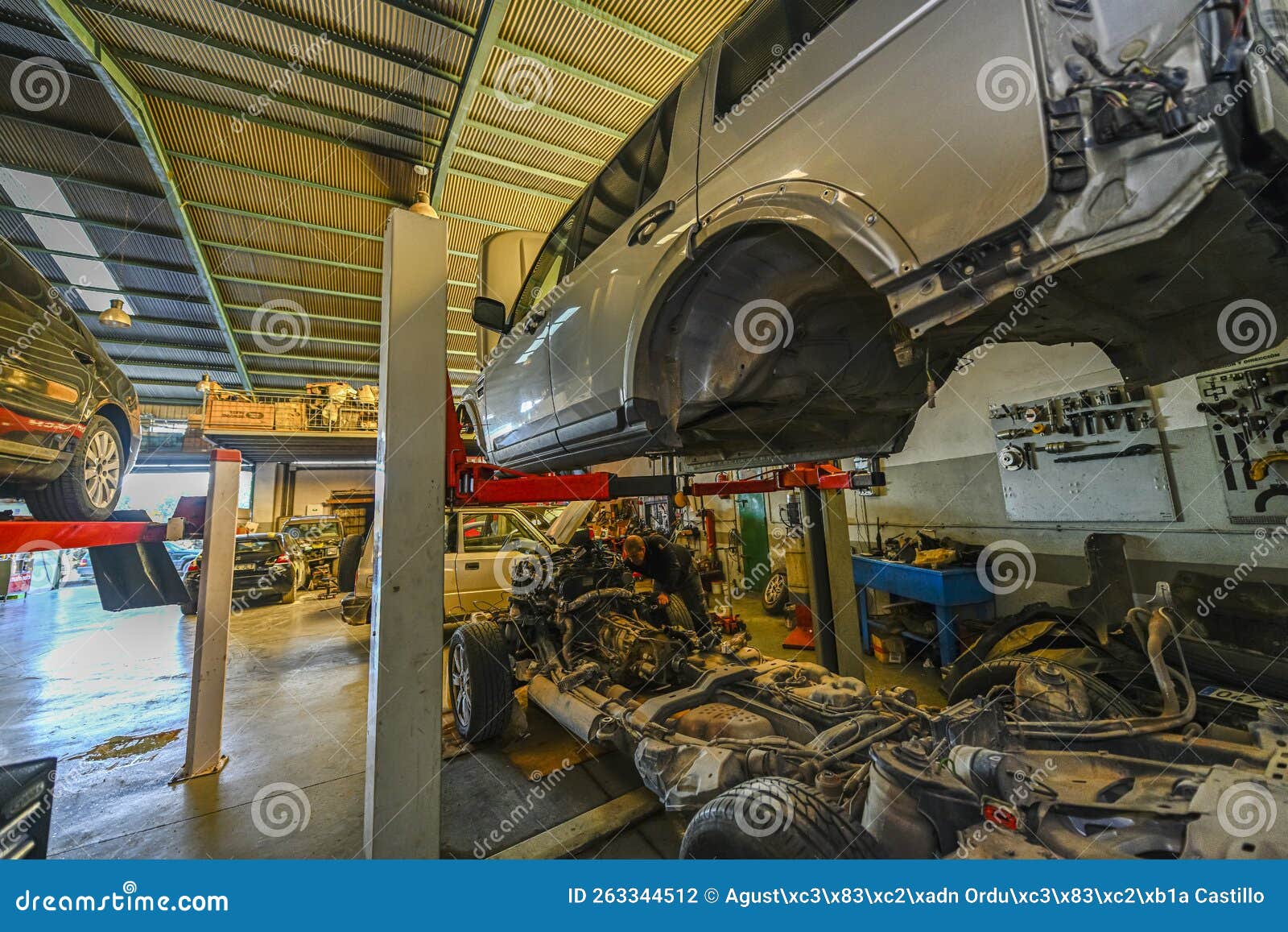 Repair of a Vehicle in the Elevator of a Mechanical Workshop. Stock ...