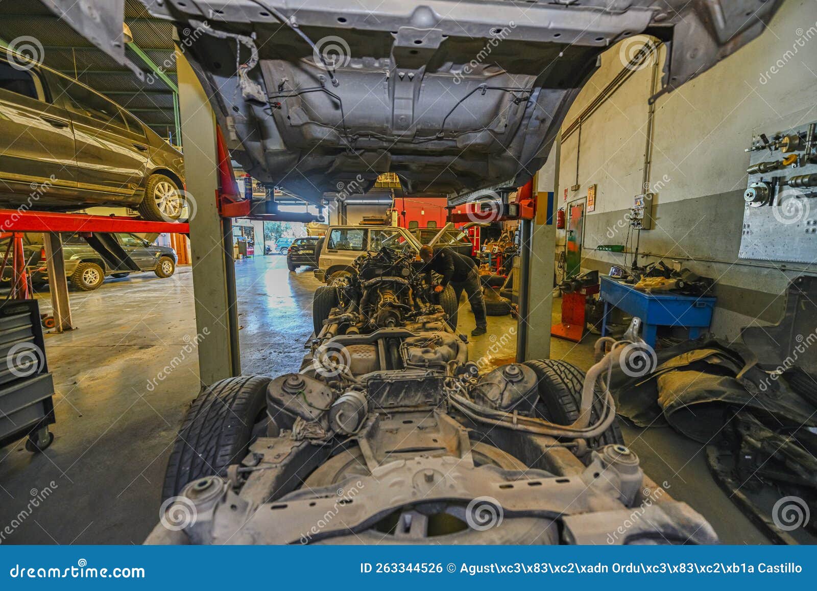 Repair of a Vehicle in the Elevator of a Mechanical Workshop. Stock ...