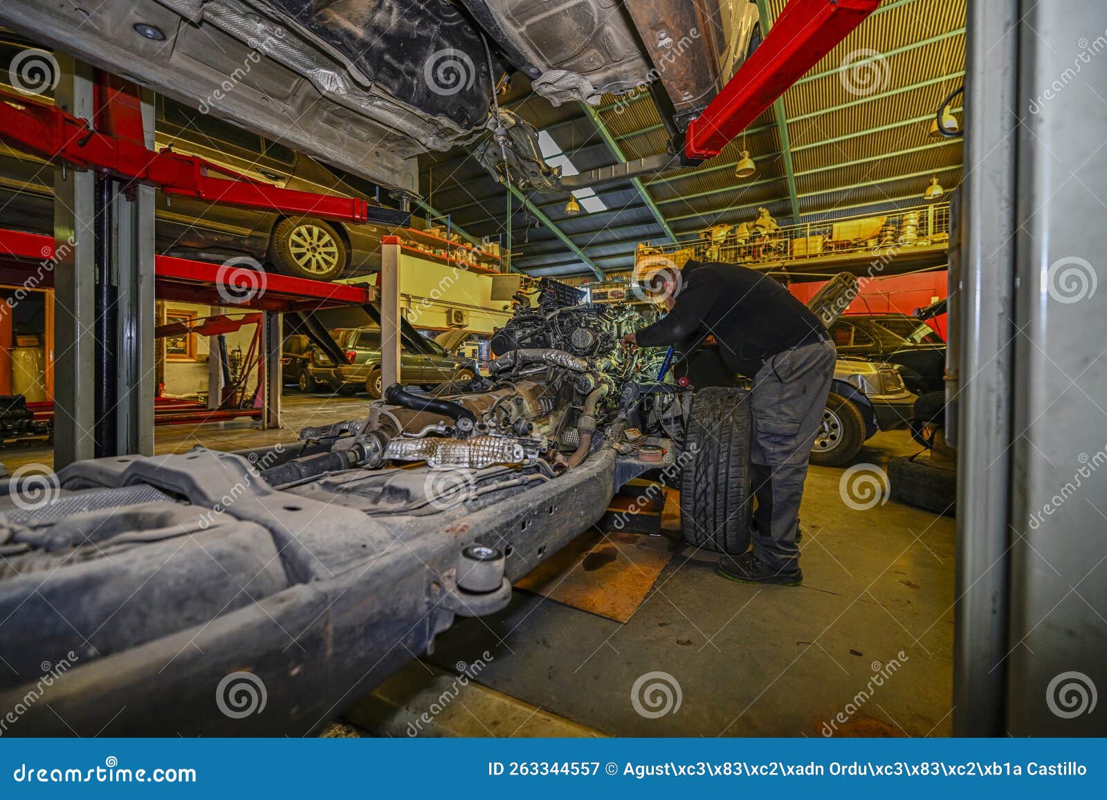 Repair of a Vehicle in the Elevator of a Mechanical Workshop. Stock ...