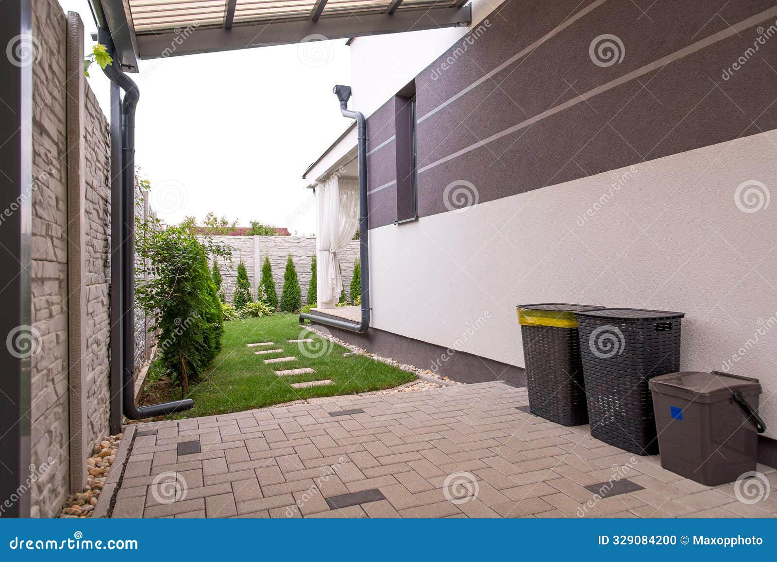 Separation Plastic Garbage Baskets by the House Entrance Door Stock ...