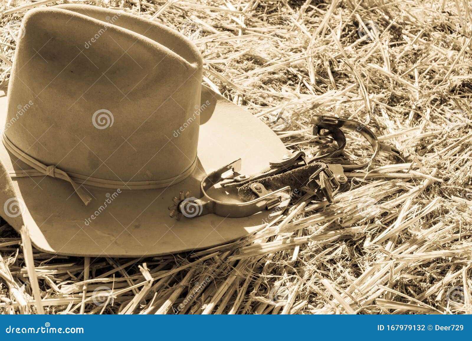 Sepia Cowboy Hat and Spurs Laying on Straw Stock Photo - Image of spur ...