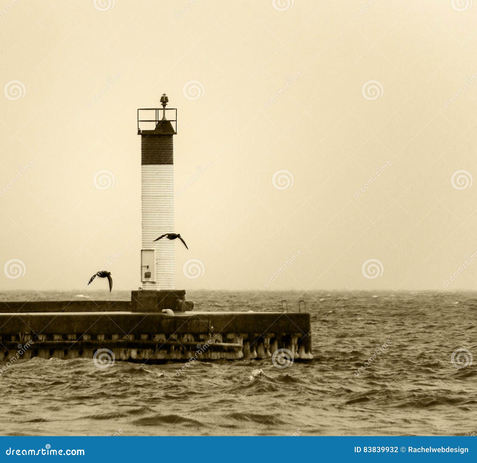 Sepia Toned Image of Lighthouse on a Pier with Flying Birds Silhouetted ...