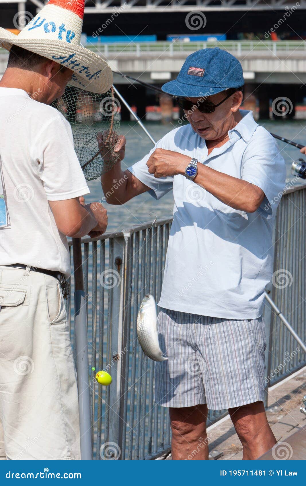 1 Sept 2007 the Old Man Releasing Fish while Standing at Shore ...