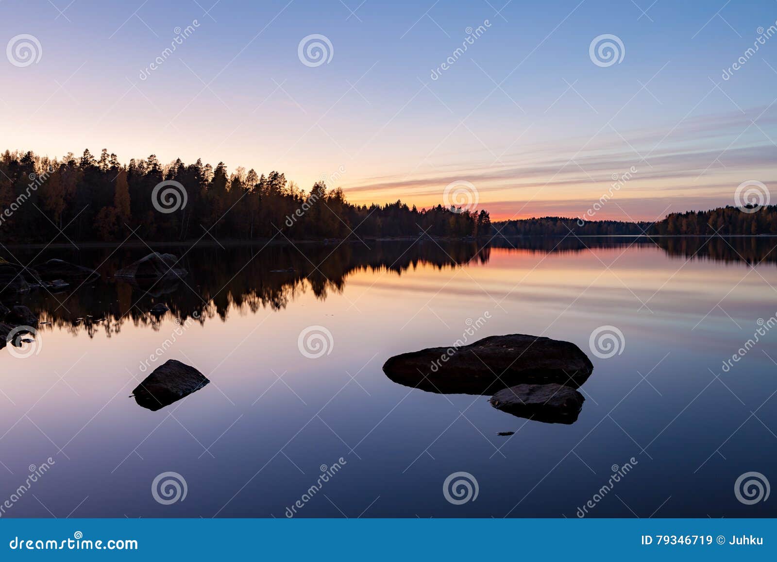 Serene view of calm lake stock image. Image of lake, clouds - 79346719