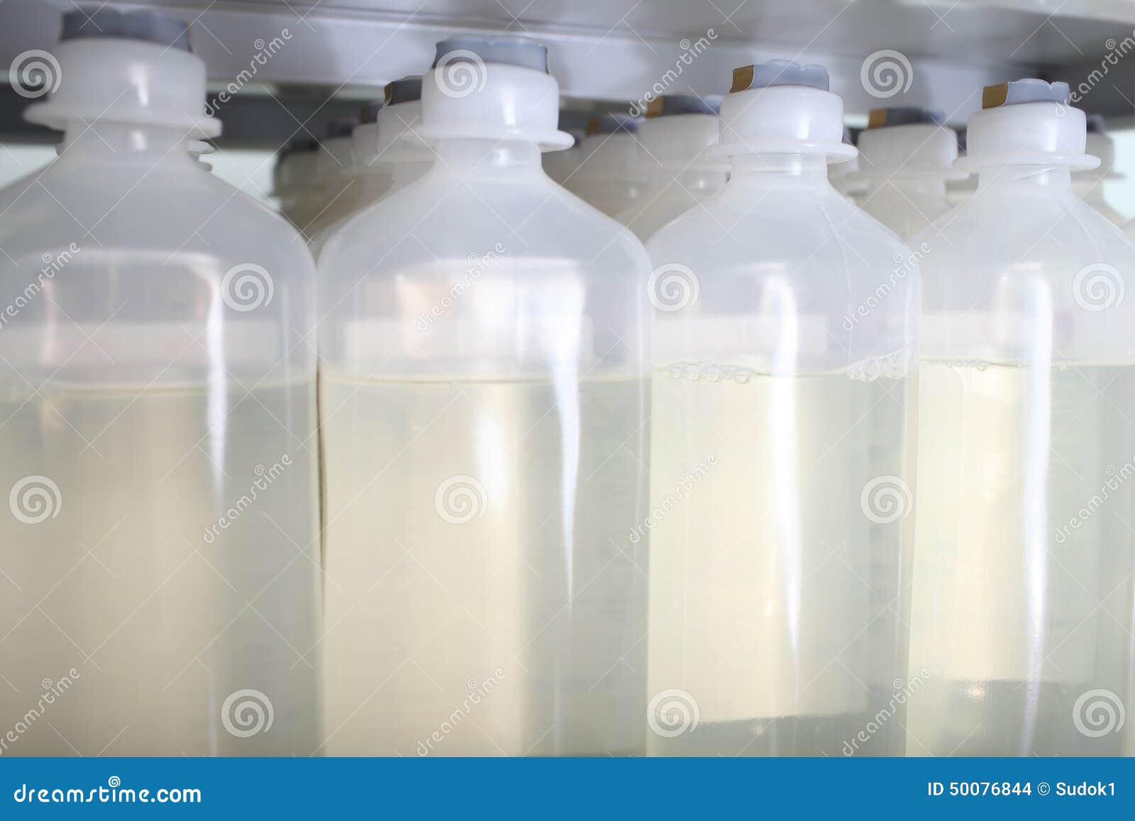 Series of Bottles with Medical Solutions in the Warehouse Stock Photo ...