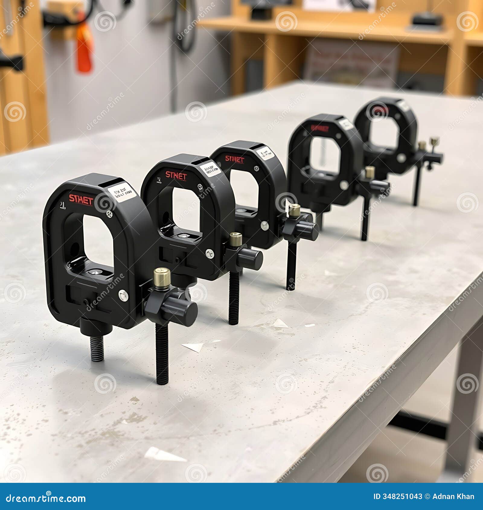 A Series of Clamps on Display Each Held in a Different Position on a ...