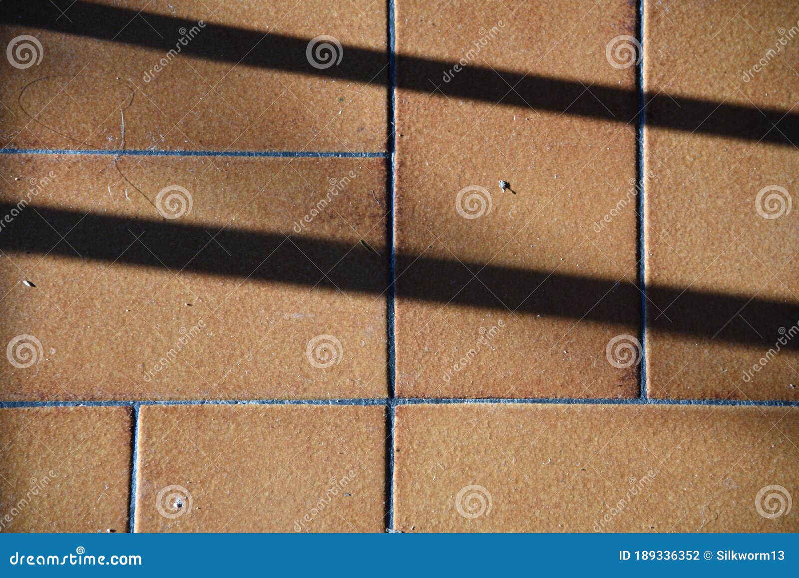 Shadow on Brown Ceramic Tiles Stock Photo - Image of light, putzen ...
