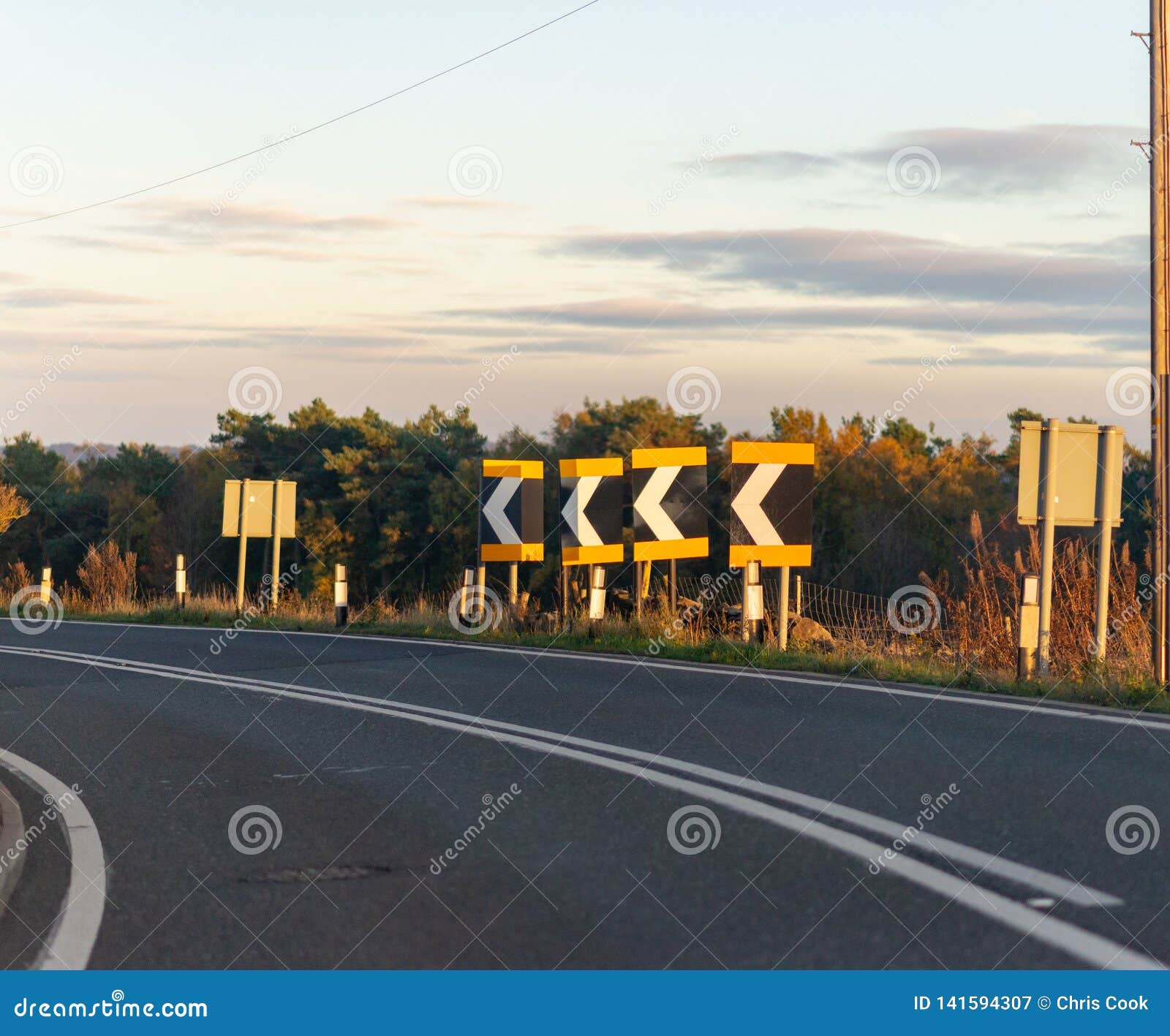 A Series of Signs Warn Drivers of a Sharp Bend in the UK Stock Image ...
