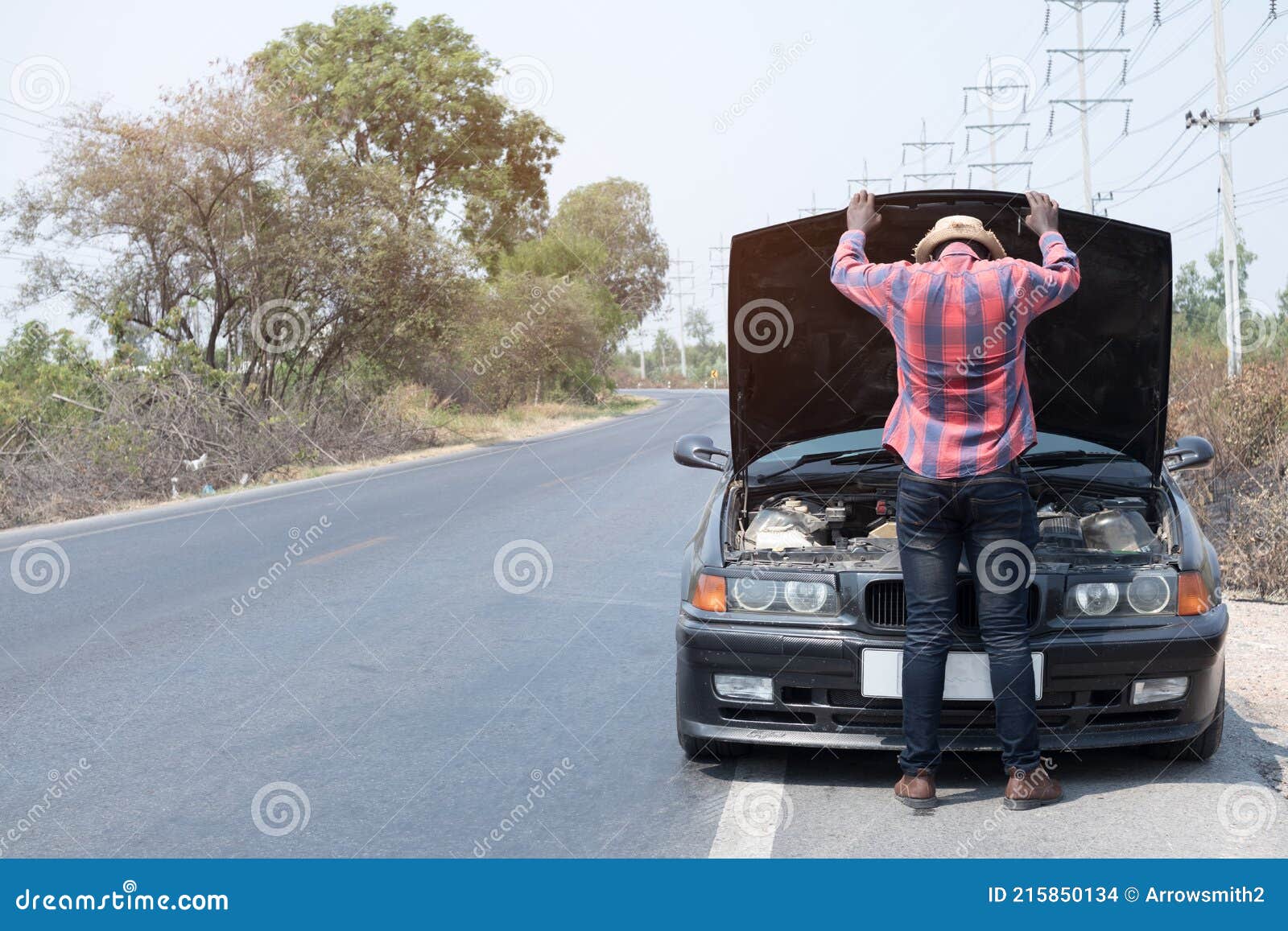 Serious African Man Looking at Engine of the Broken Car Stock Photo ...