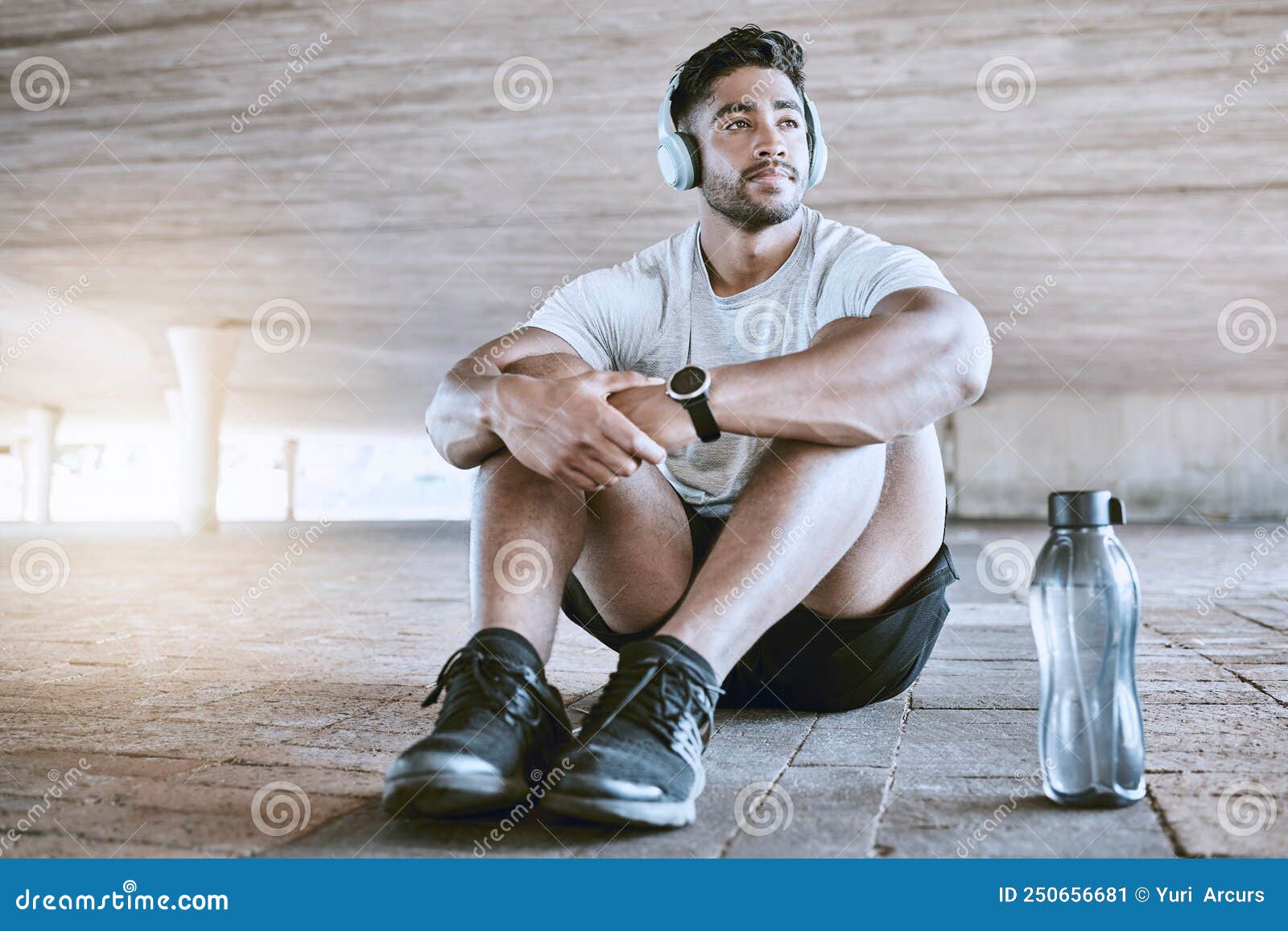 Serious Athlete Taking Break from Workout. Young Man Getting Ready To ...