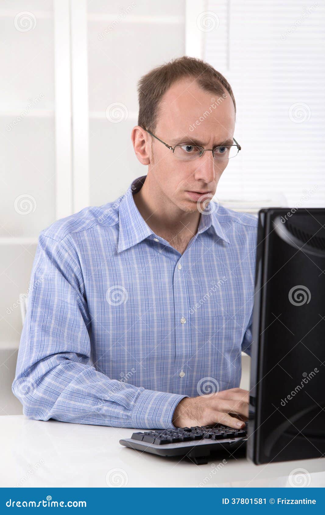 Serious Bald Businessman in Blue Shirt Working at Computer at Office ...