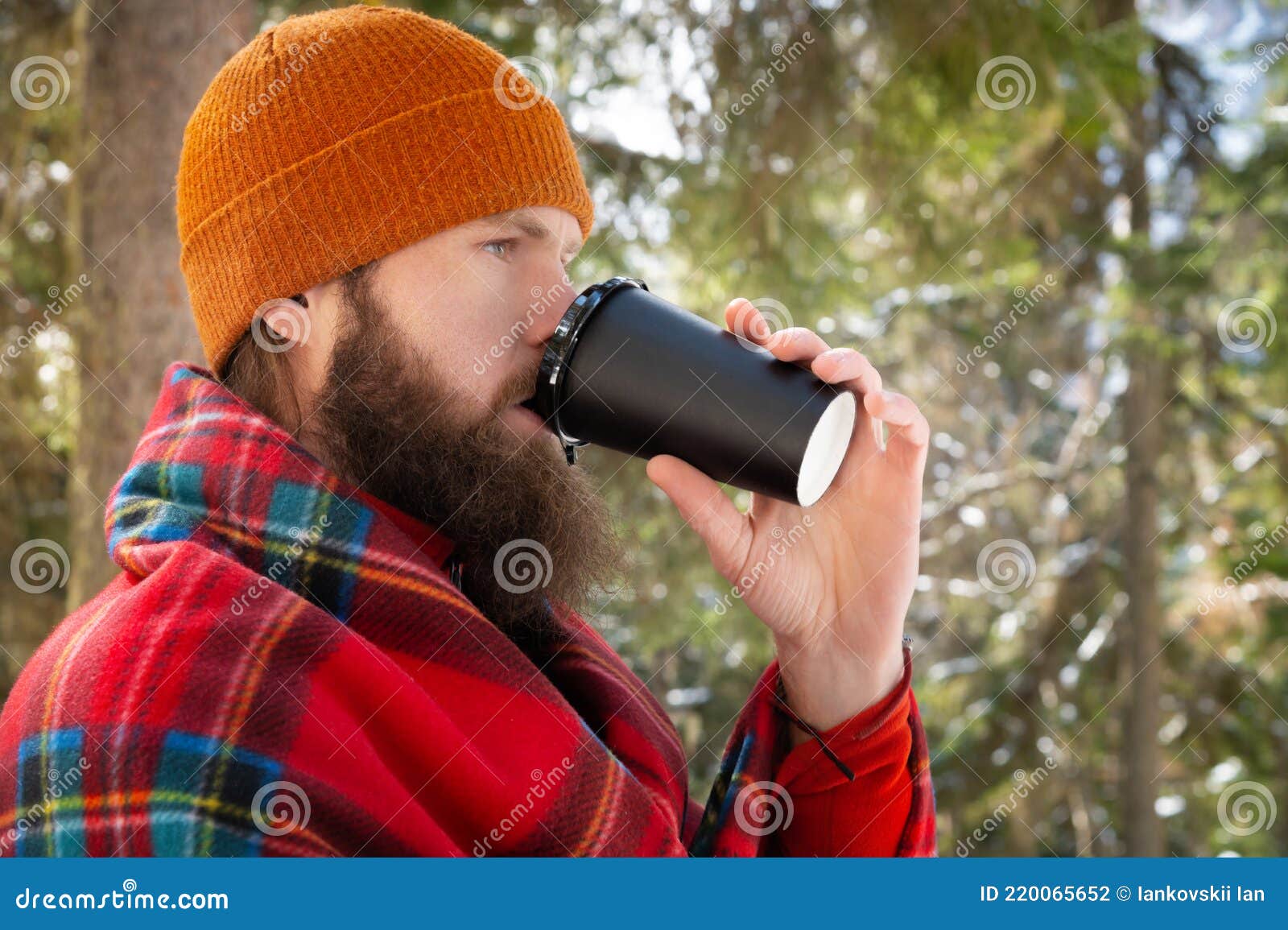 Serious Bearded Caucasian Man Drinking Coffee Or Tea From Black Paper