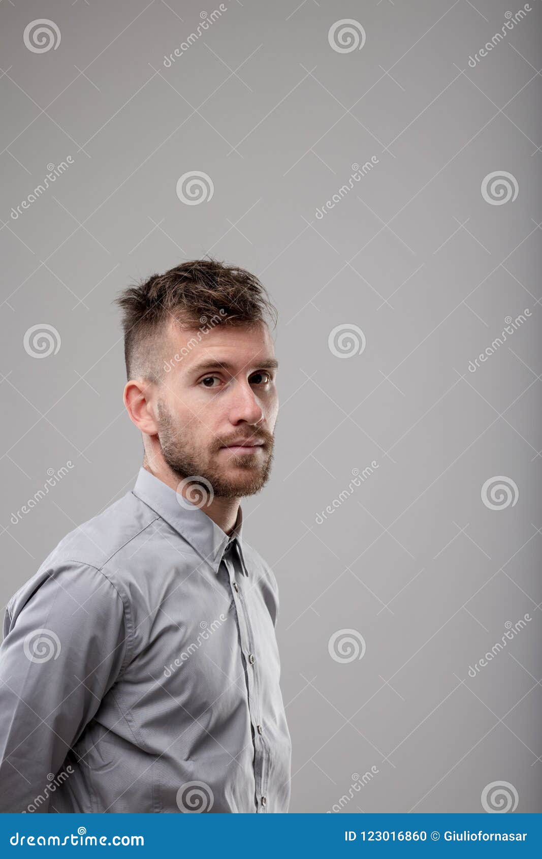 Serious Bearded Man Looking Sideways at Camera Stock Photo - Image of ...