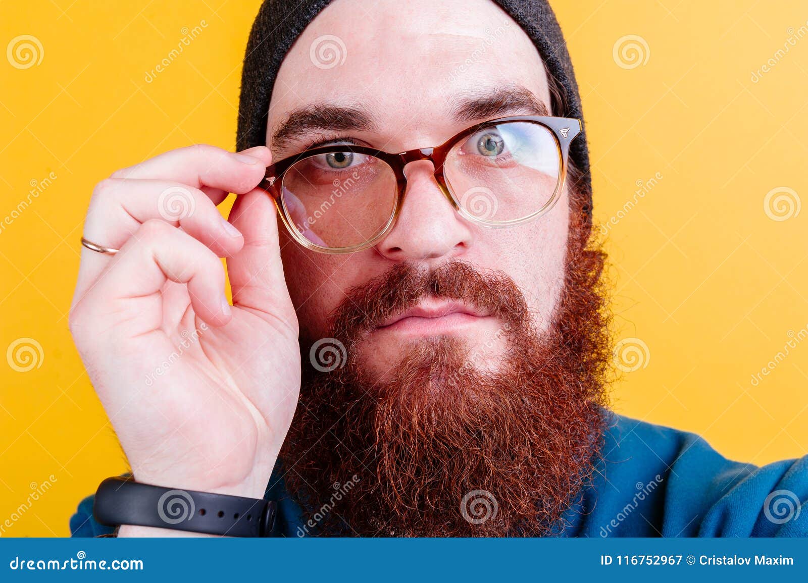 Serious Bearded Man Touching Eyeglasses Stock Image Image Of