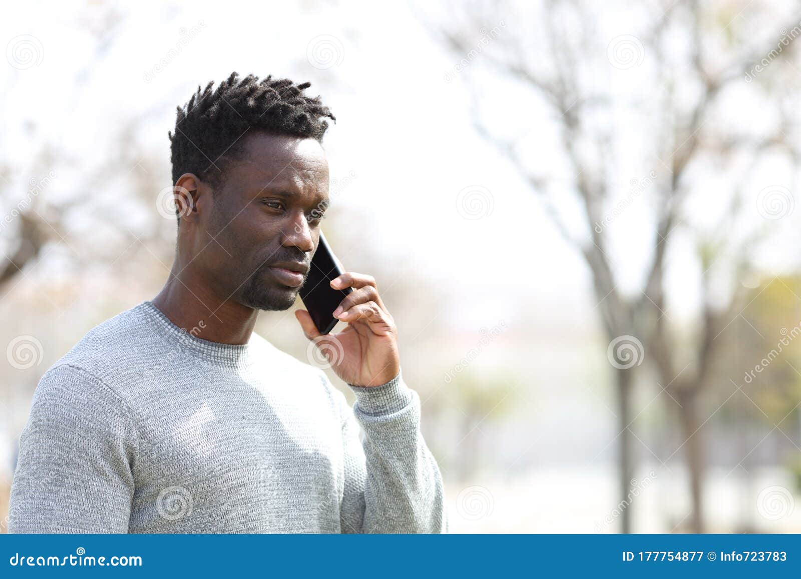 Serious Black Man Calling on Smart Phone at Park Stock Image - Image of ...