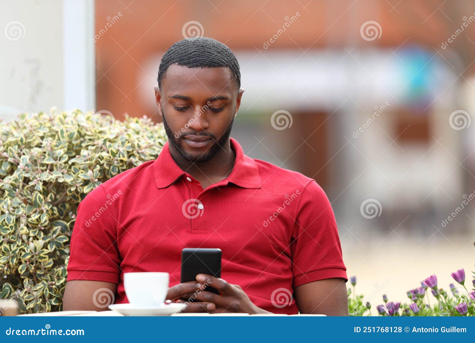 Serious Black Man Using Phone in a Bar Stock Photo - Image of diverse ...