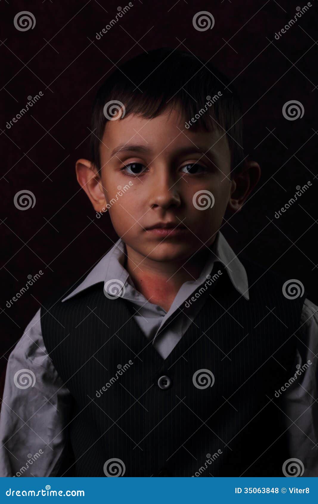 Serious Boy on Brown Background Stock Photo - Image of childhood, happy ...
