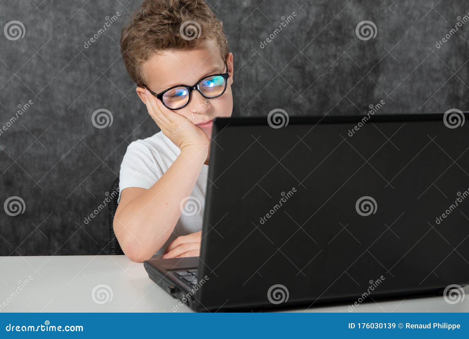 Serious Boy Sitting with Laptop Computer Stock Image - Image of student ...