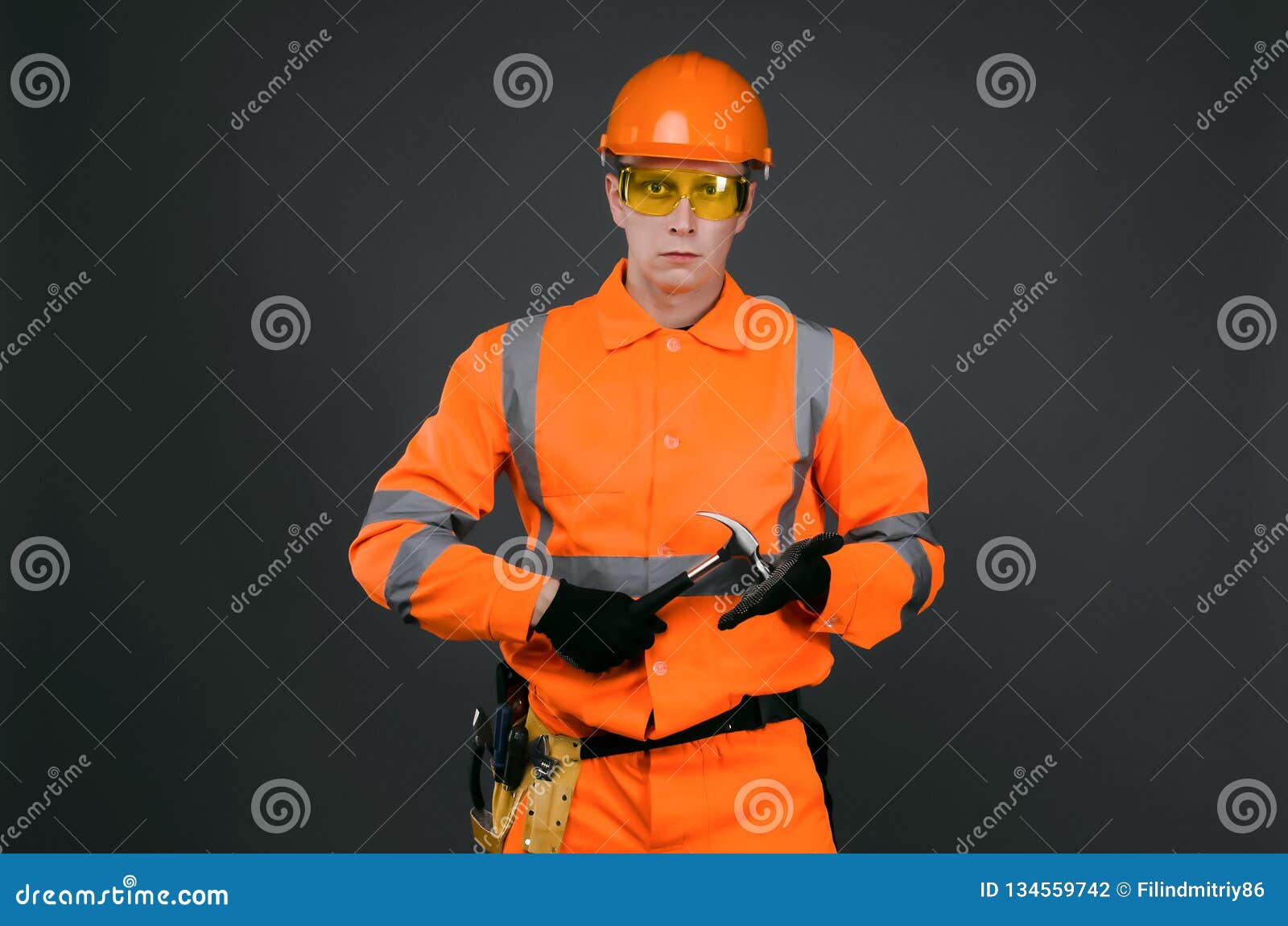 Builder with hammer. stock photo. Image of mechanic - 134559742