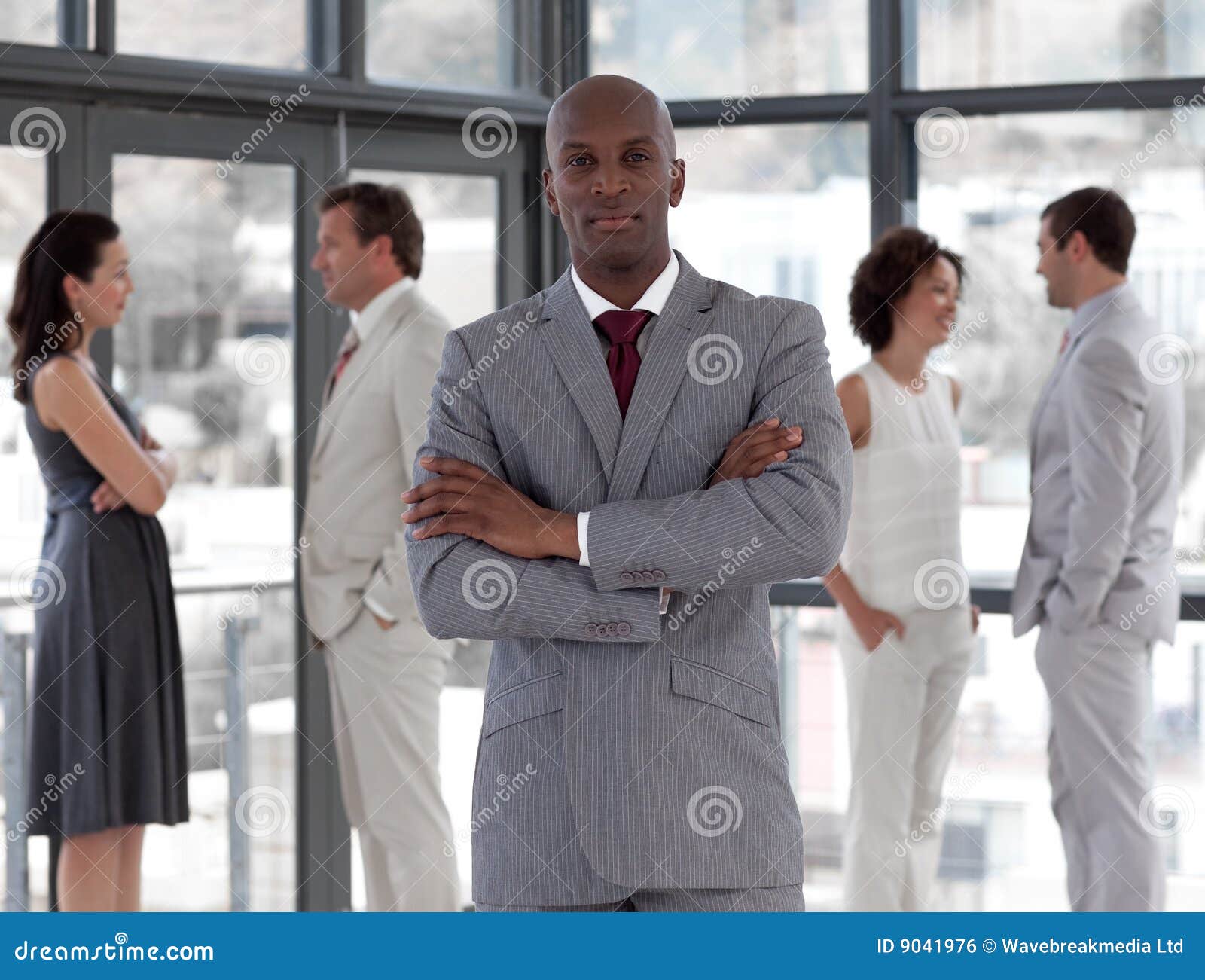 A Serious Business Man with Business Team Stock Photo - Image of ethnic ...