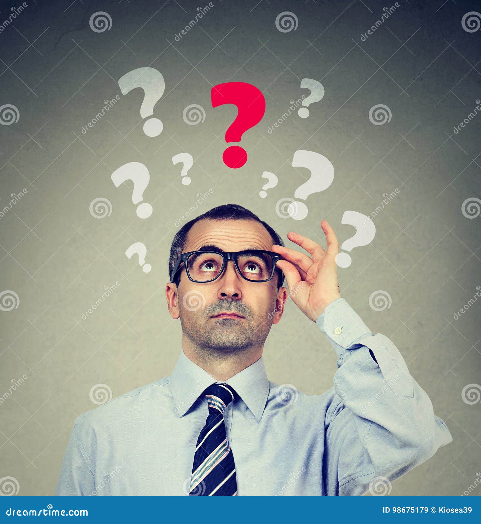 Serious Business Man Looking Up at a Key Question Stock Image - Image ...