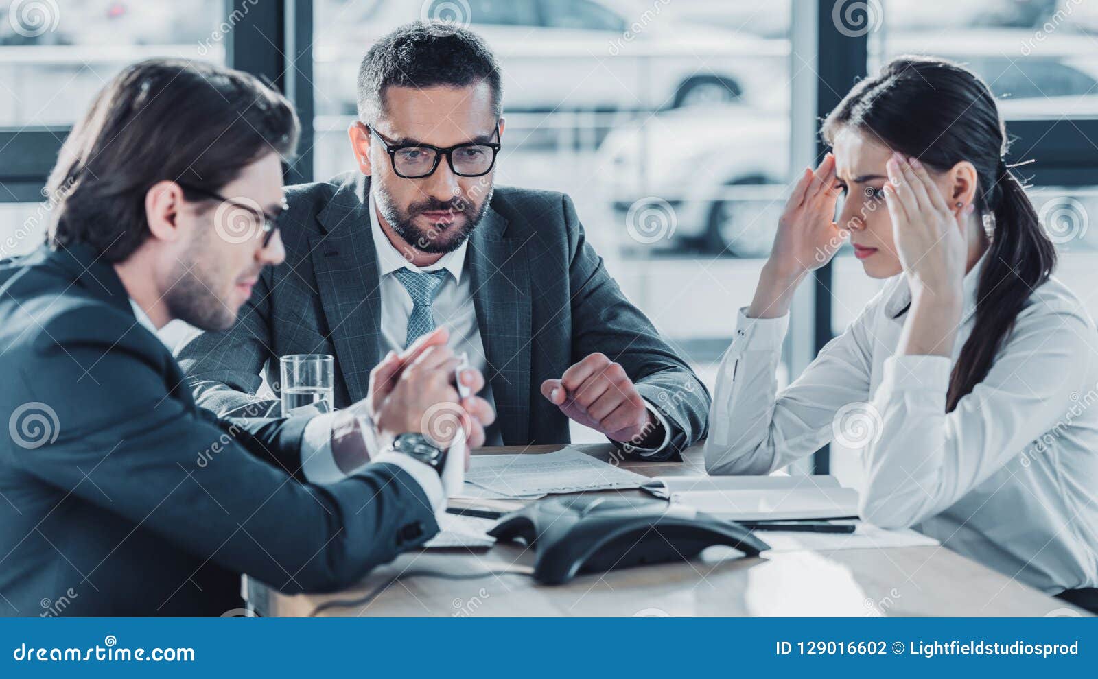 Serious Business People Having Conversation and Using Speakerphone ...