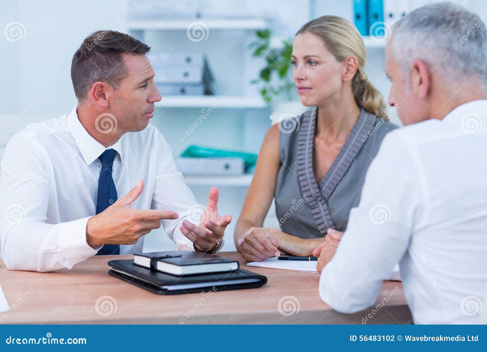 Serious Business People Speaking at Meeting Stock Photo - Image of ...