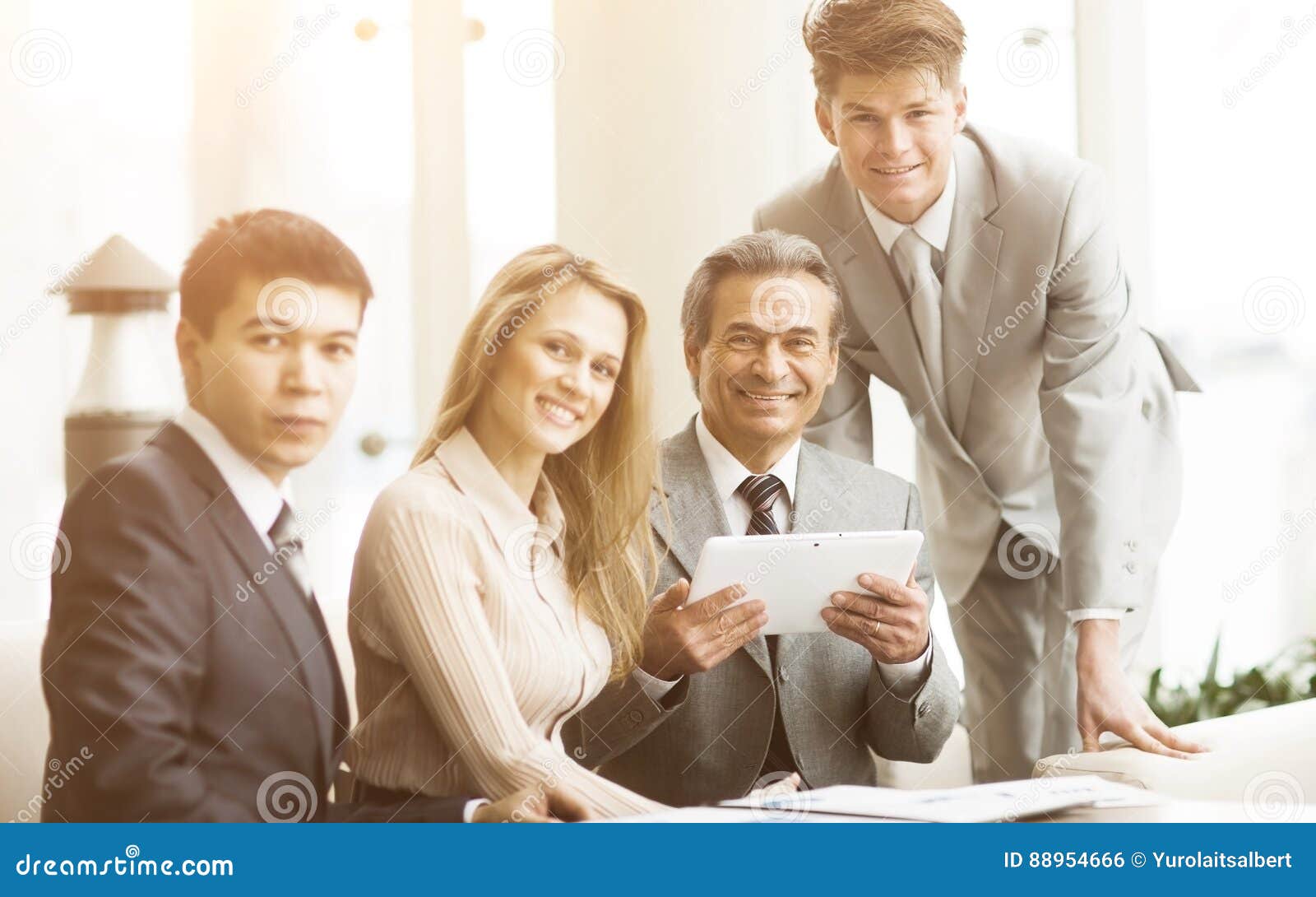 Serious Business Team with Tablet Computers, Documents Having ...