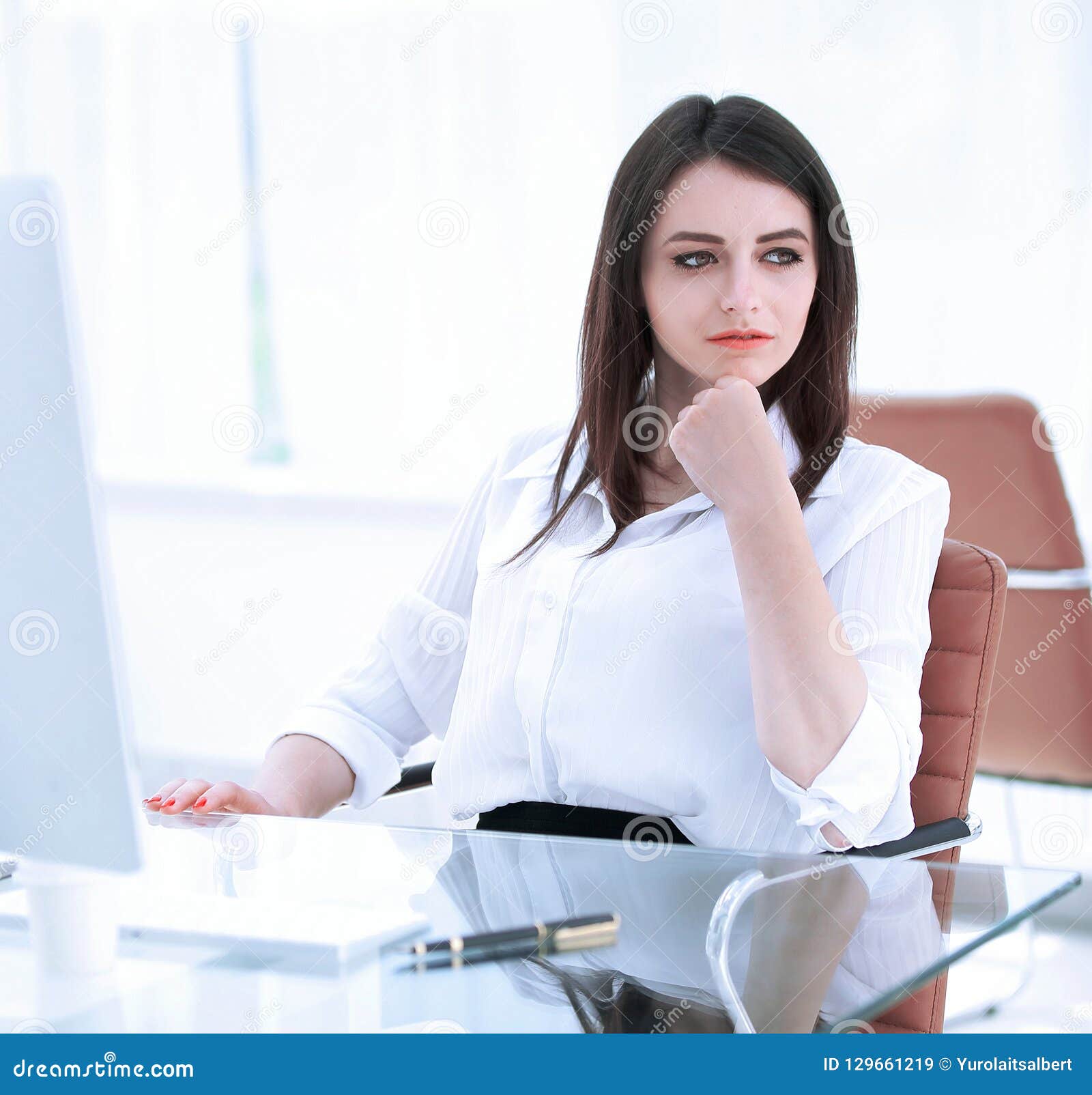 Serious Business Woman Sitting at the Desk in the Office Stock Image ... Serious Business Woman Sitting at the Desk in the Office Stock Image ...