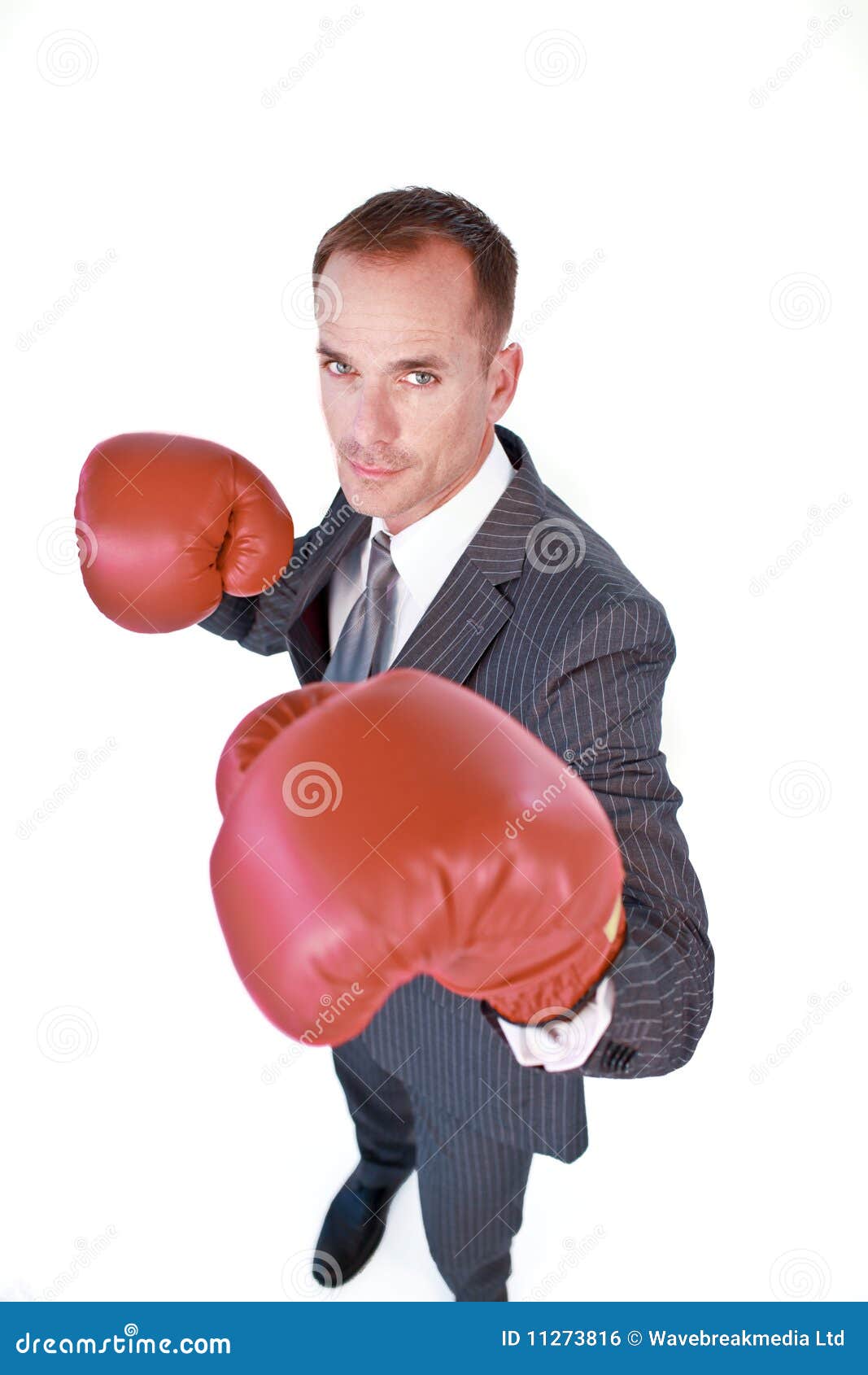 Businessman With Boxing Gloves Celebrates Victory In A Fight Against ...