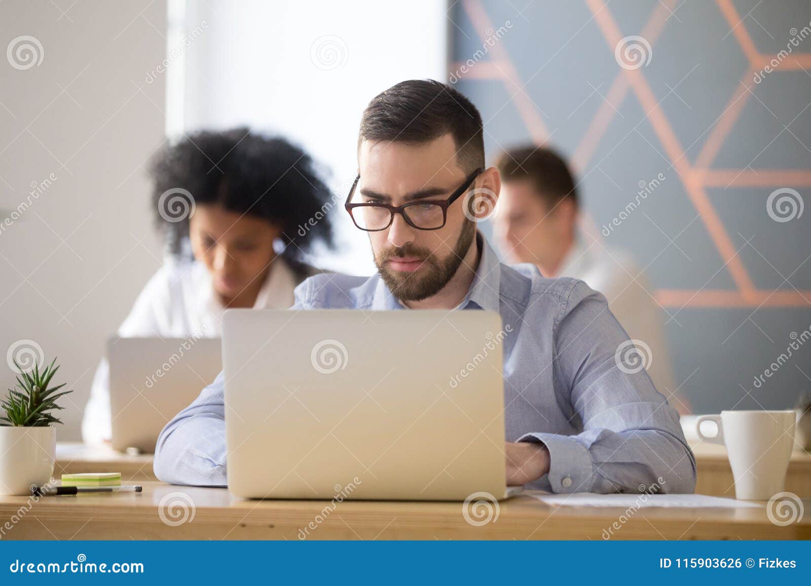Serious Businessman Focused on Computer Online Work in Coworking Stock ...