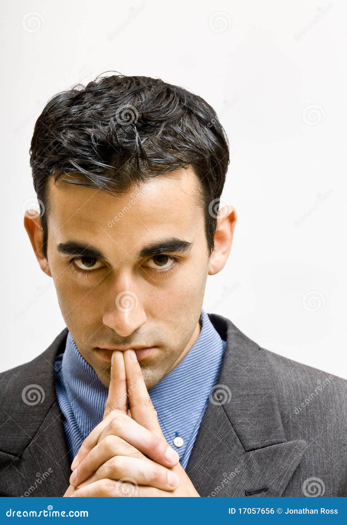 Serious Businessman with Hands Clasped Stock Photo - Image of looking ...