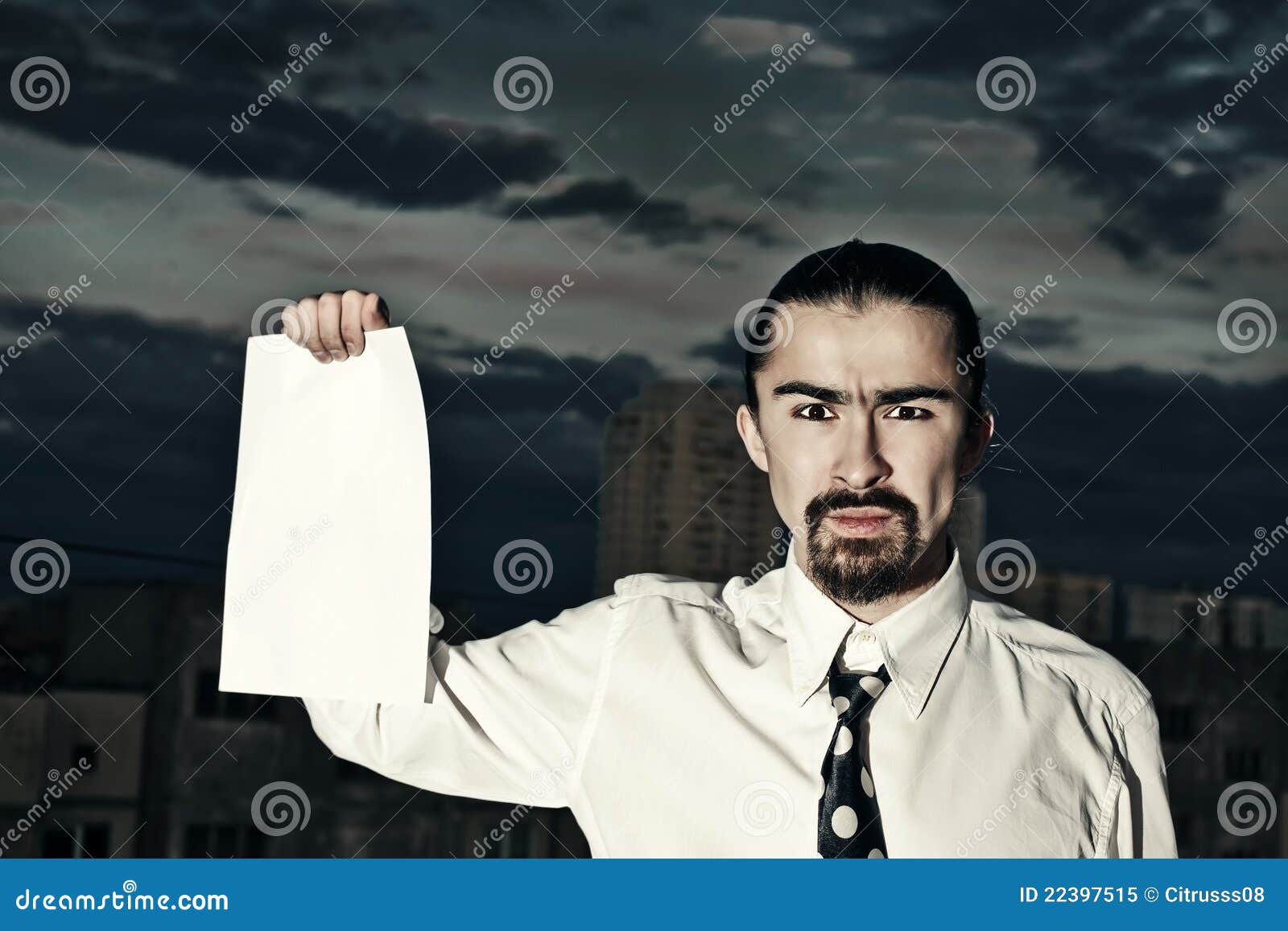 Serious Businessman Holding a Sheet of Paper Stock Image - Image of ...