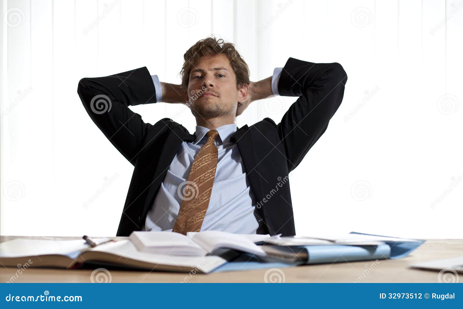 Serious Businessman Leaning Back Stock Photo - Image of leaning ...