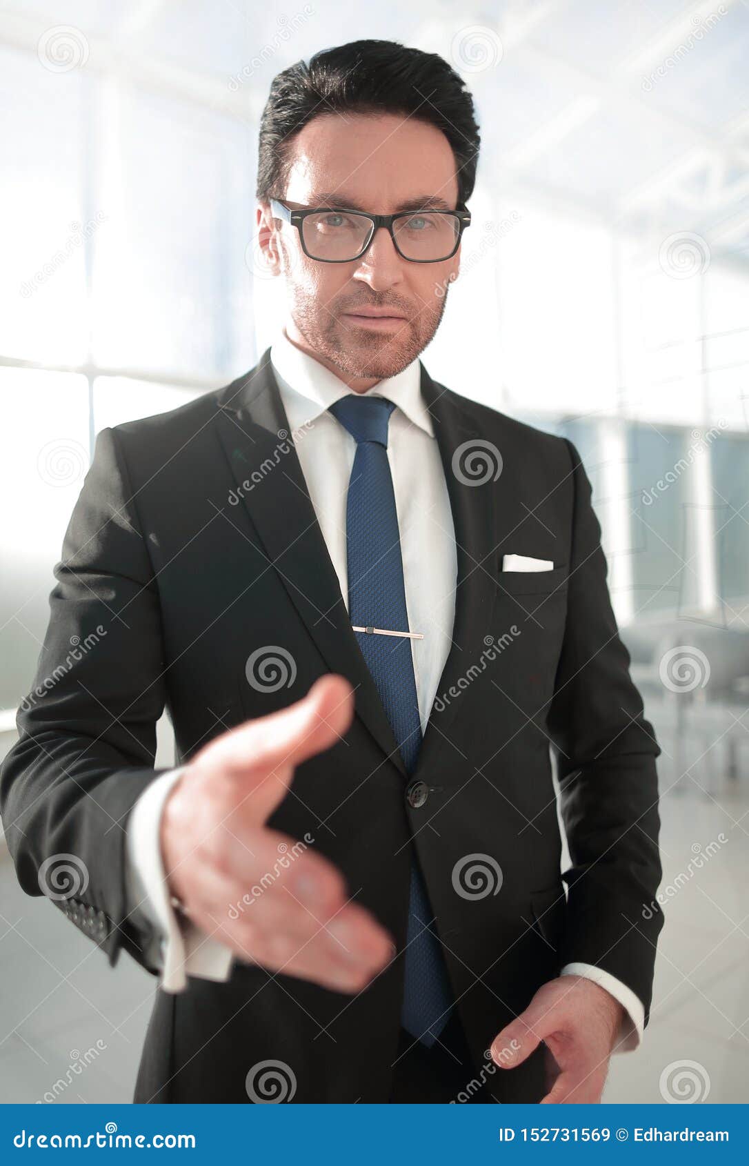 Serious Businessman Reaching Out for a Handshake Stock Image - Image of ... Serious Businessman Reaching Out for a Handshake Stock Image - Image of ...