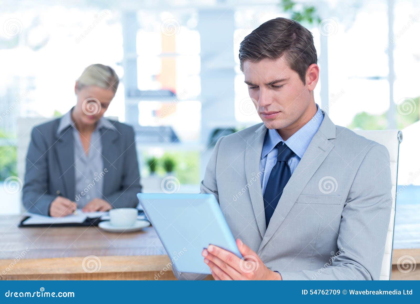 Serious Businessman Reading a File Stock Image - Image of chair ...