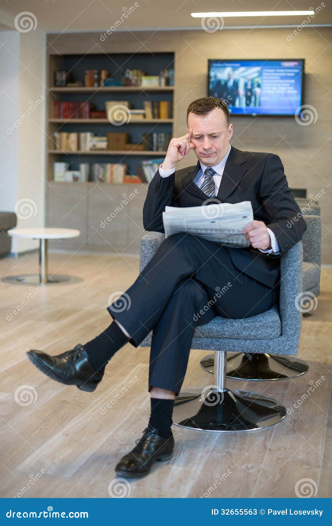 A Serious Businessman Reading a Newspaper Stock Image - Image of career ...
