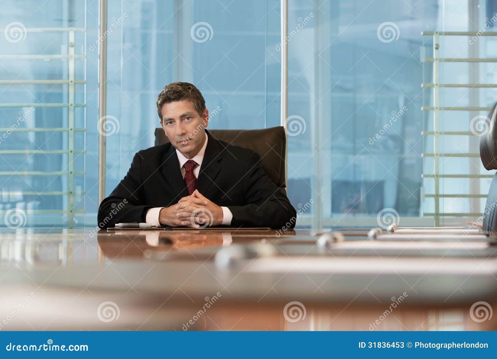 Serious Businessman Sitting at Conference Table Stock Image - Image of ...