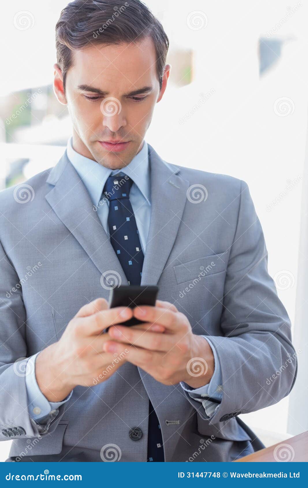 Serious Businessman Texting on Phone Stock Photo - Image of businessman ...