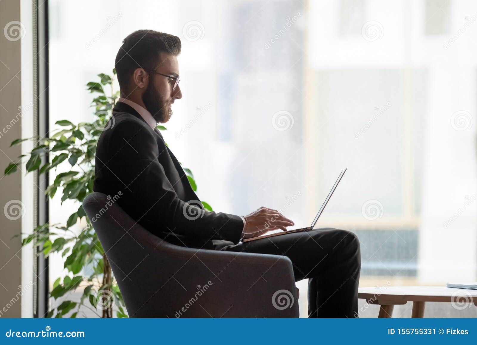 Serious Businessman Wearing Glasses Using Laptop Near Big Window Stock Image Image Of