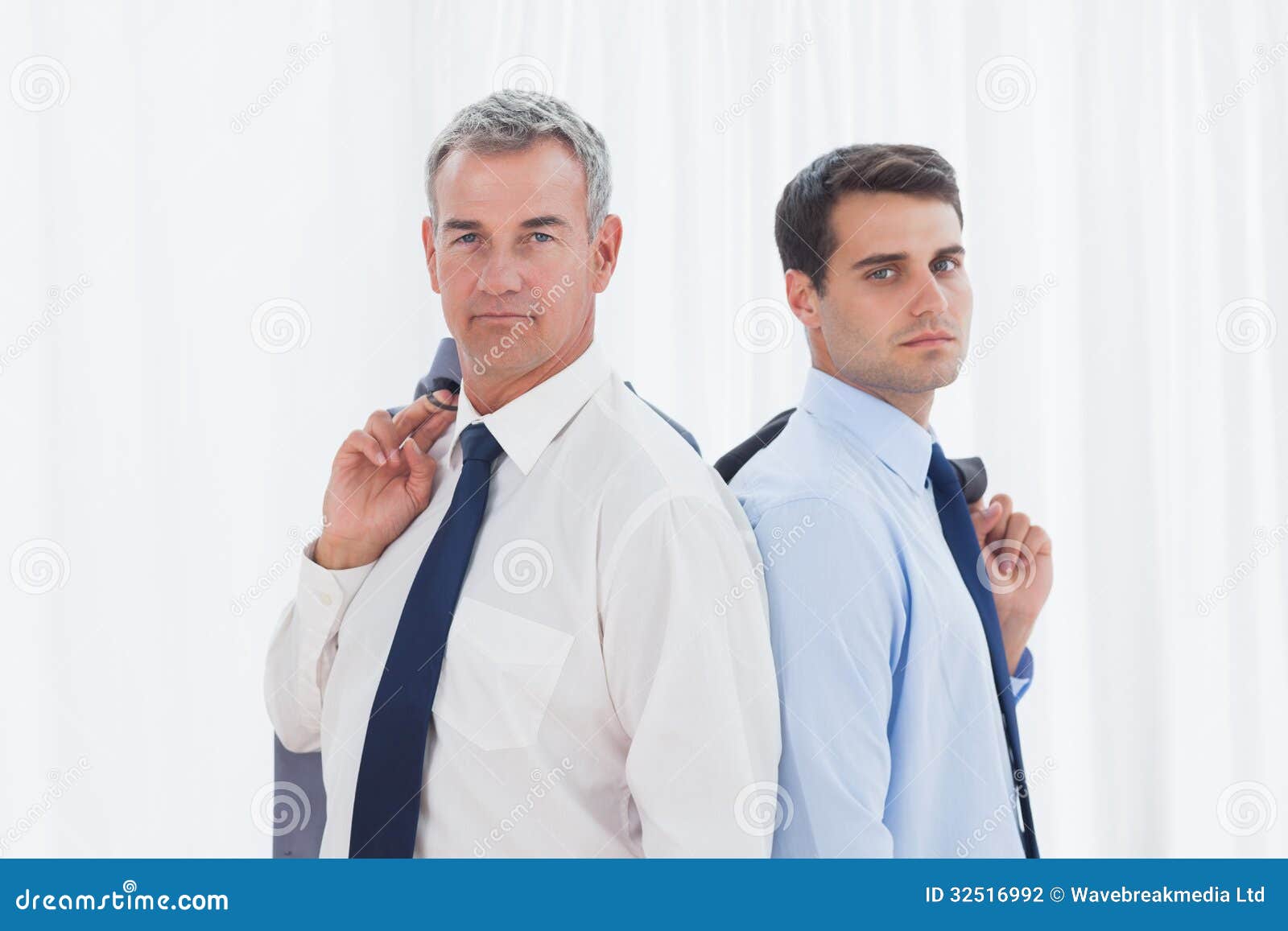 Serious Businessmen Posing Back To Back Together Stock Photo - Image of ...