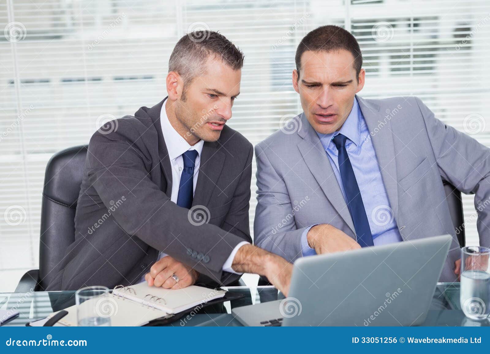 Serious Businessmen Working on Their Laptop Stock Photo - Image of ...