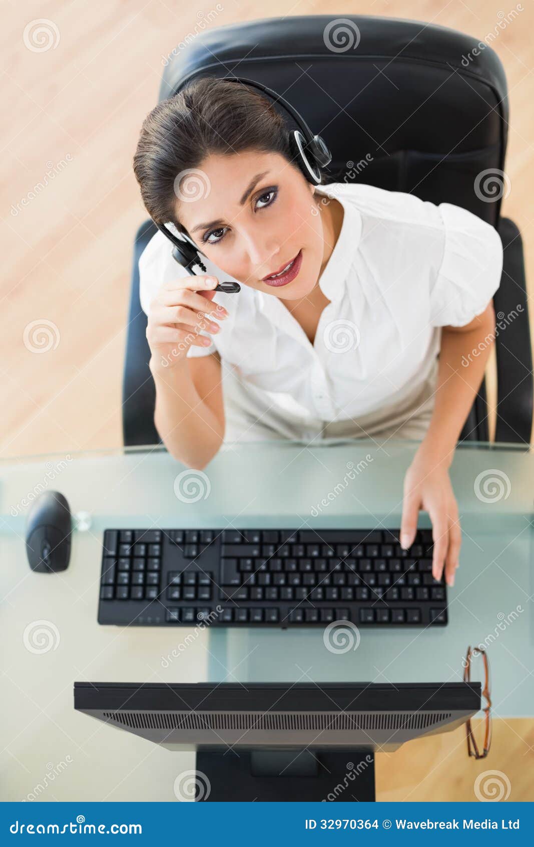 Serious Call Center Agent Looking at Camera while on a Call Stock Photo ...
