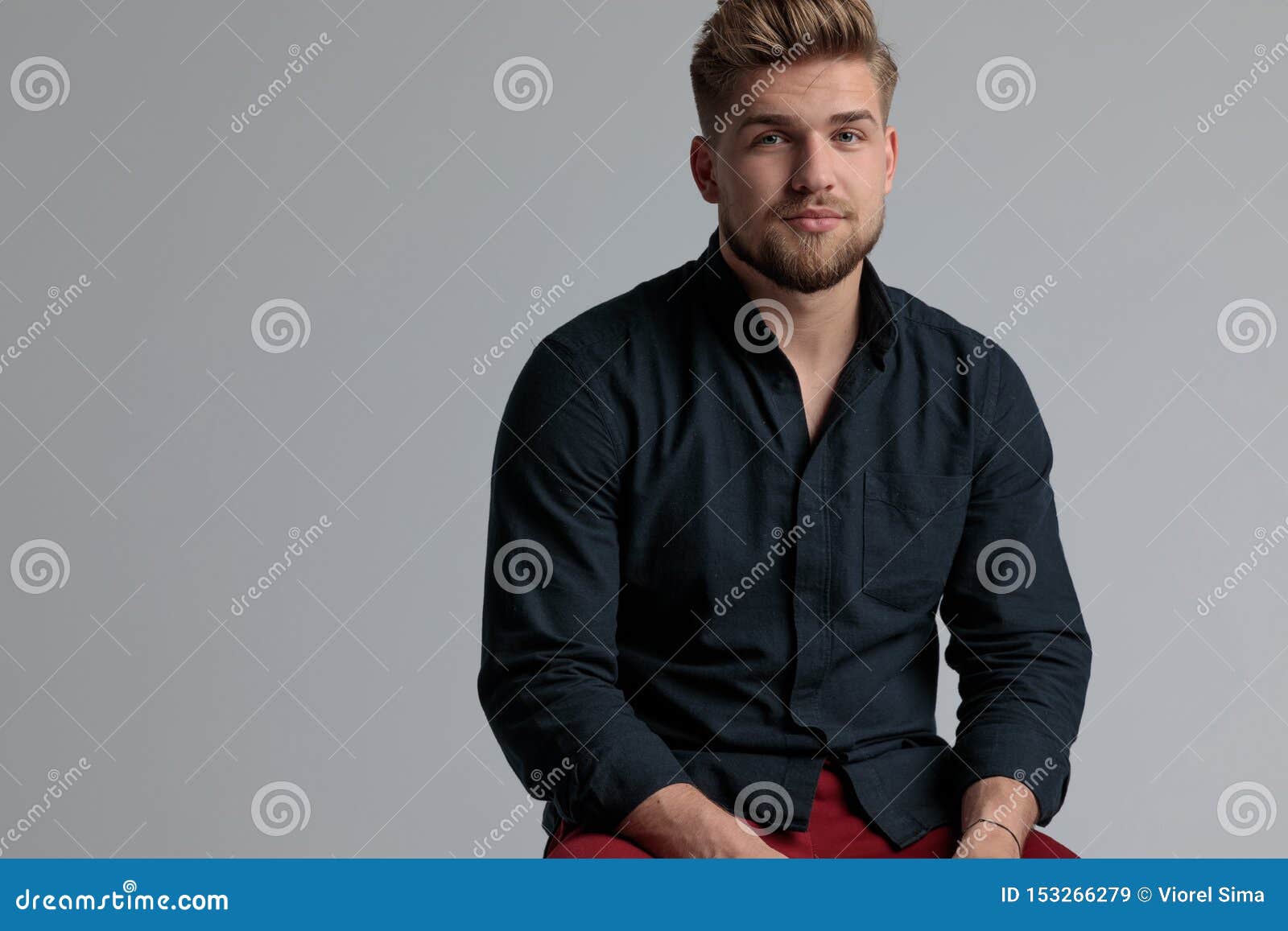 Serious Casual Man Wearing a Blue Shirt and Red Jeans Stock Image ... Serious Casual Man Wearing a Blue Shirt and Red Jeans Stock Image ...