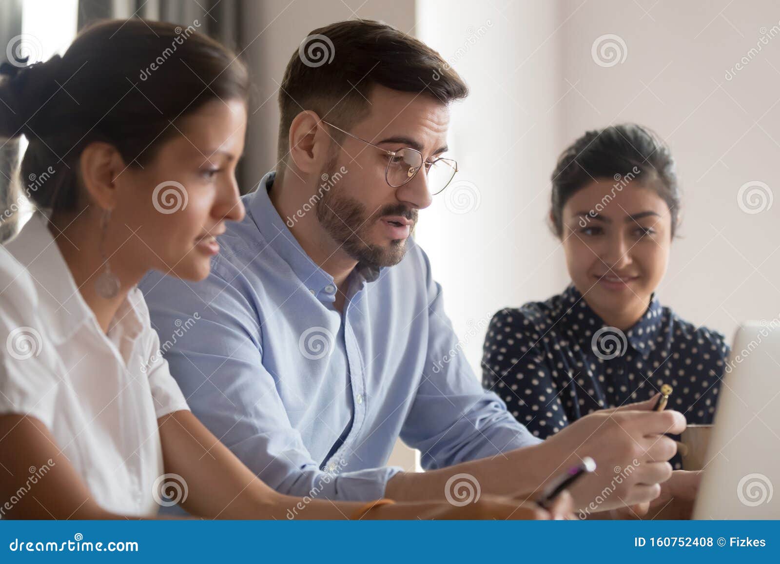 Serious Caucasian Teacher Instructing Diverse Students Explaining ...