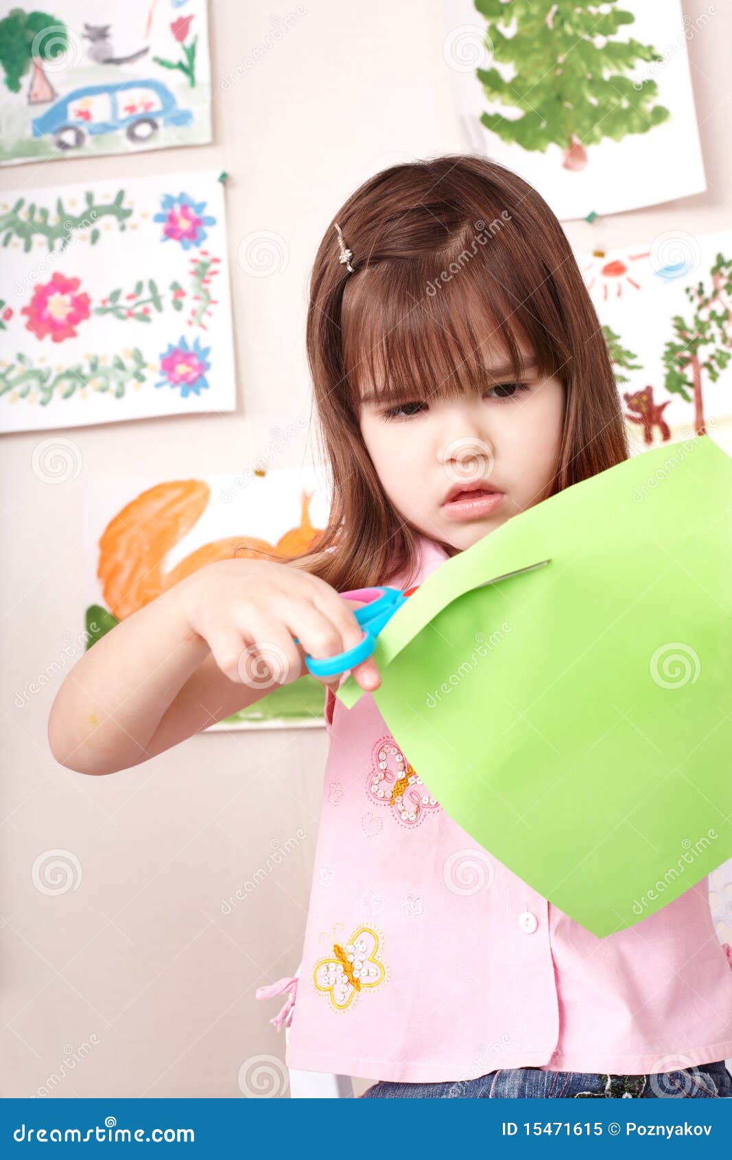 Serious Child Cutting Paper. Royalty Free Stock Photo - Image: 15471615