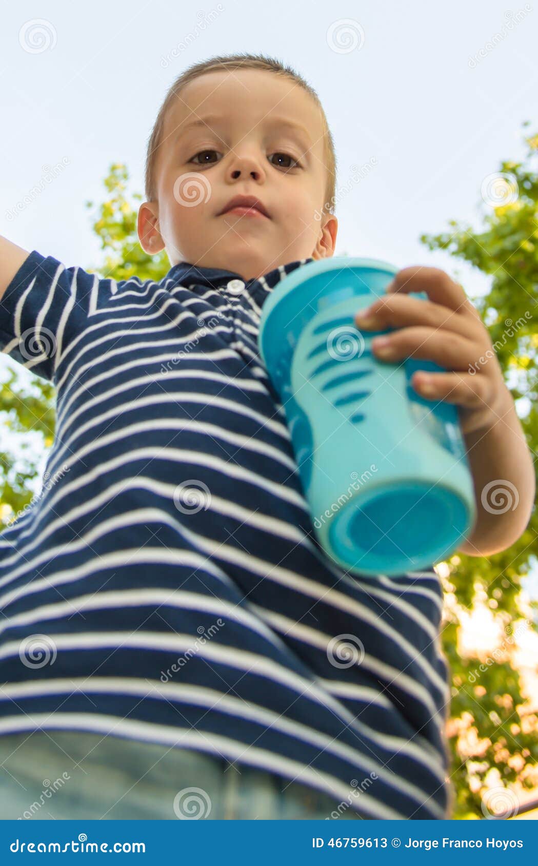 Serious child looking down stock image. Image of spring - 46759613